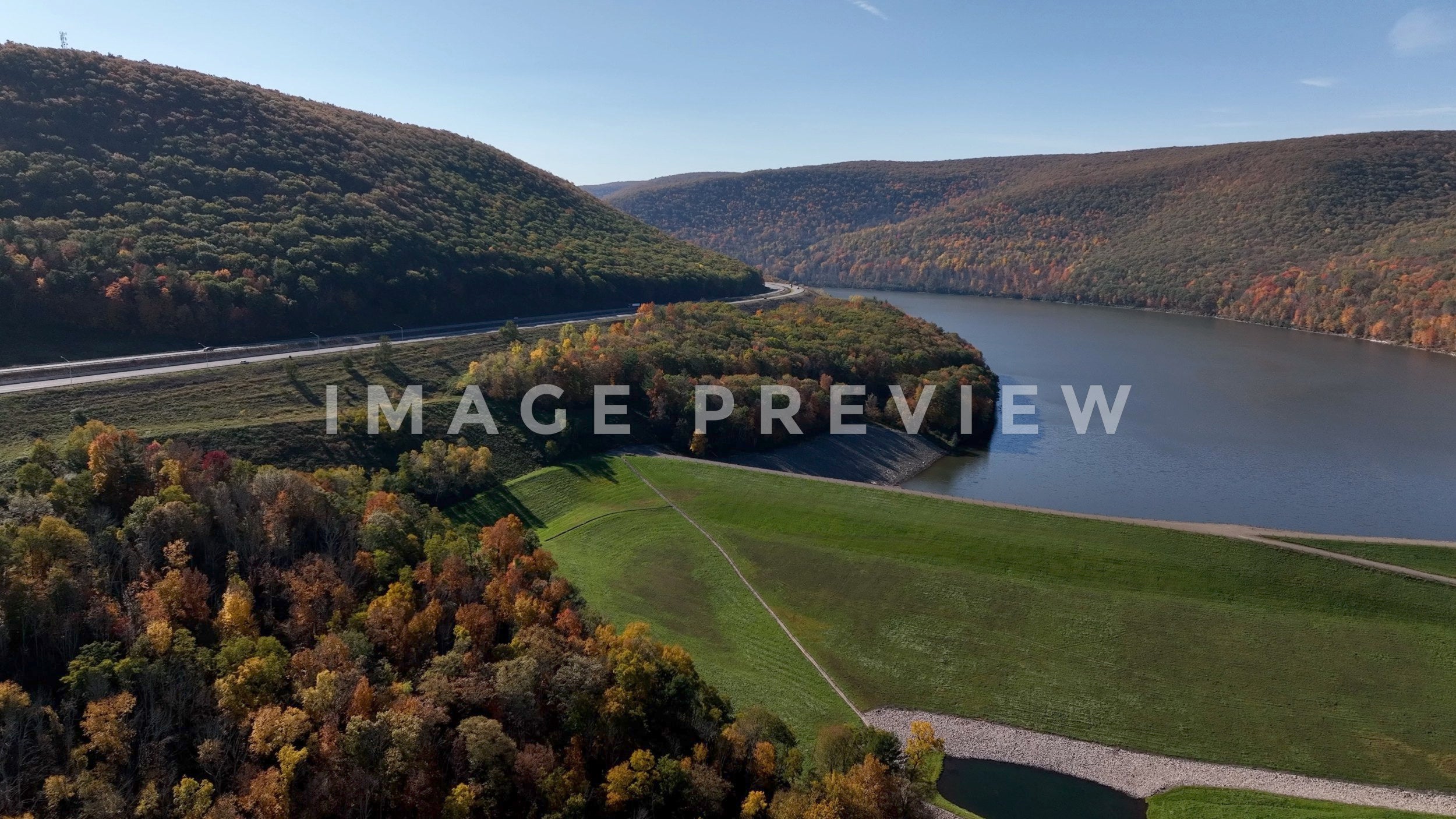 Beautiful Tioga Reservoir beside highway and mountains in Fall colors ...